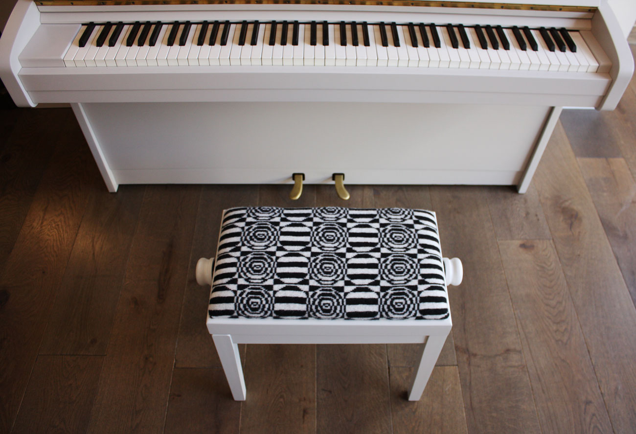 Piano stools featuring fabric by Sue Bradley