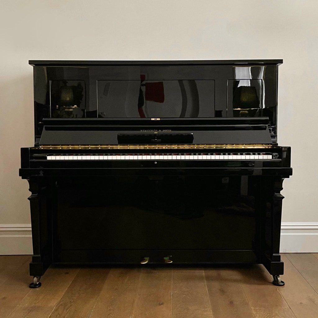 A Steinway Model K Upright Piano